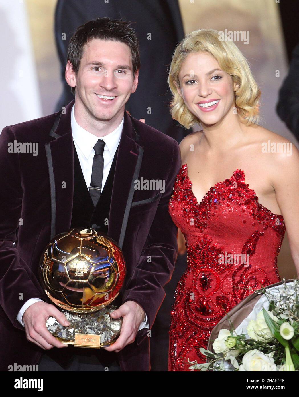 Argentina's Lionel Messi stands next to Colombian singer Shakira after ...