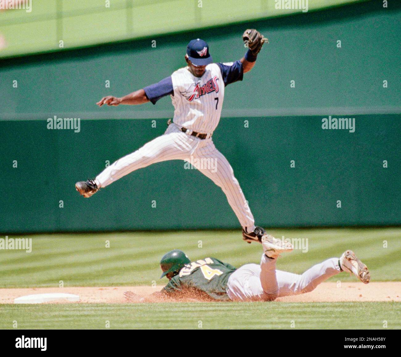 Anaheim Angels' second baseman Paco Martin jumps to reach the throw ...