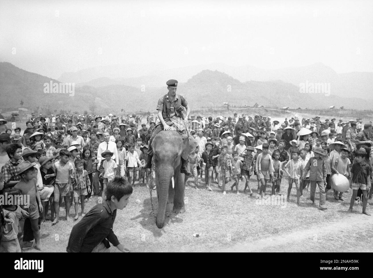 Capt. John Gantt leads the elephant, mahout-style, before Montagnard ...