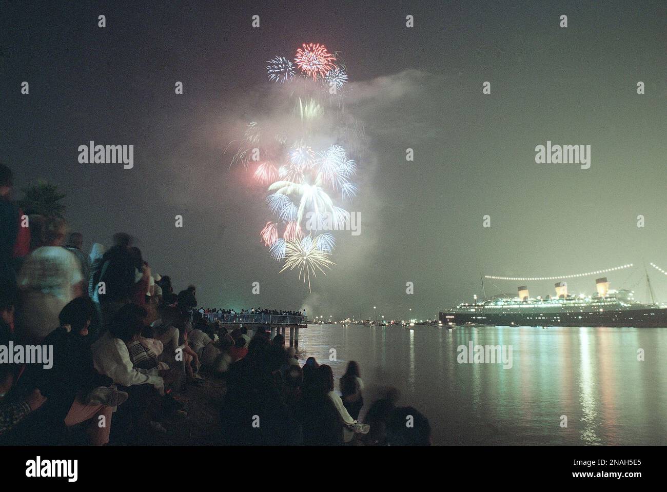 Spectators line up along the shoreline in Long Beach, Calif., to watch ...