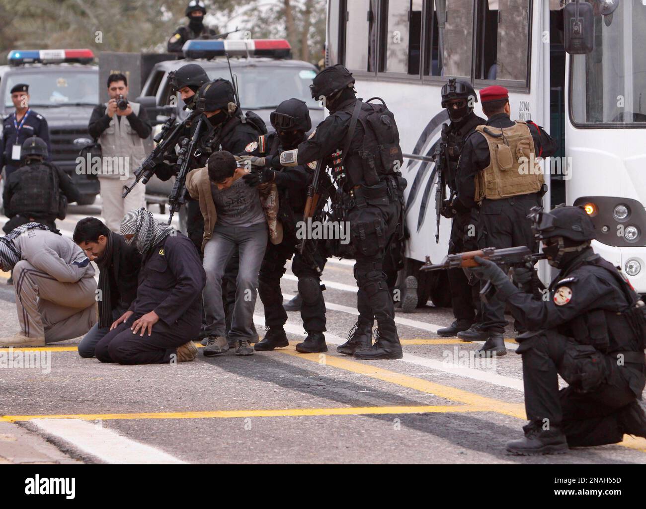 Iraqi federal police demonstrate their skills during a ceremony marking ...