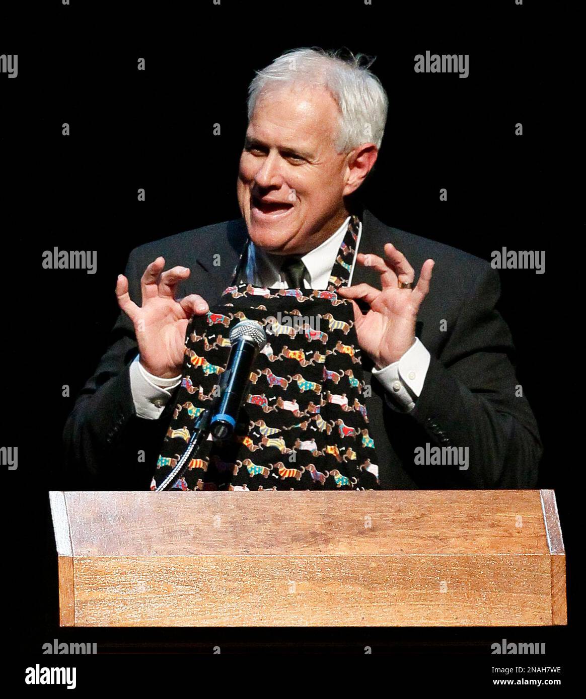 Rev. Dr. Andrew Ross holds up an apron made for him by shooting victim ...