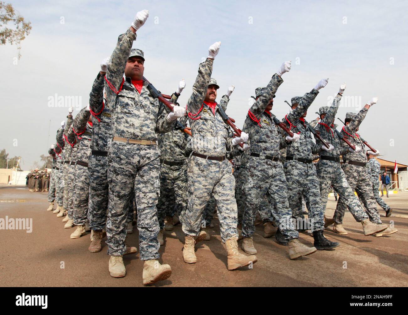 Iraqi federal police graduates march during a graduation ceremony in ...