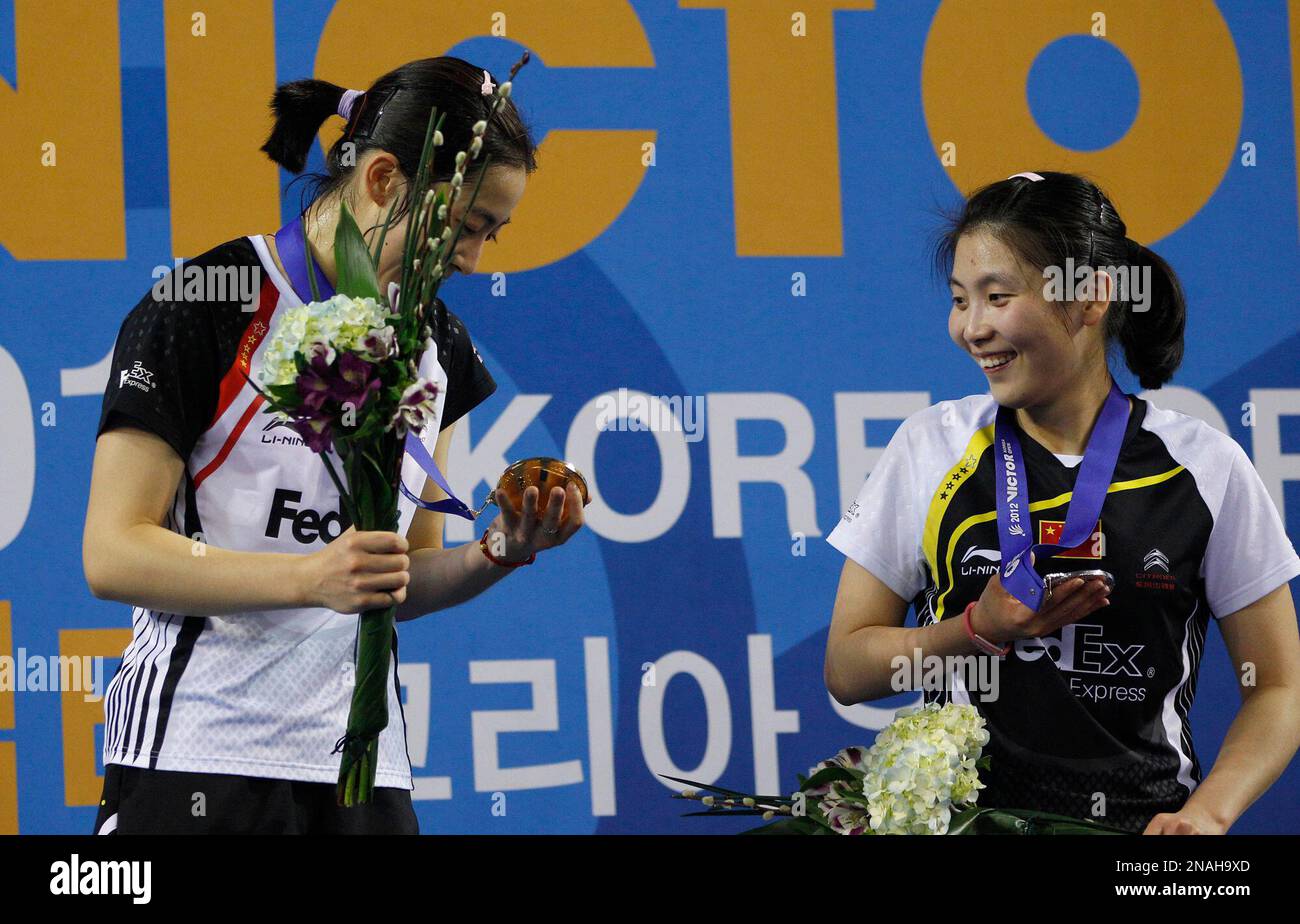 Winner China's Wang Shixian, left, and China's Jiang Yanjiao watch ...