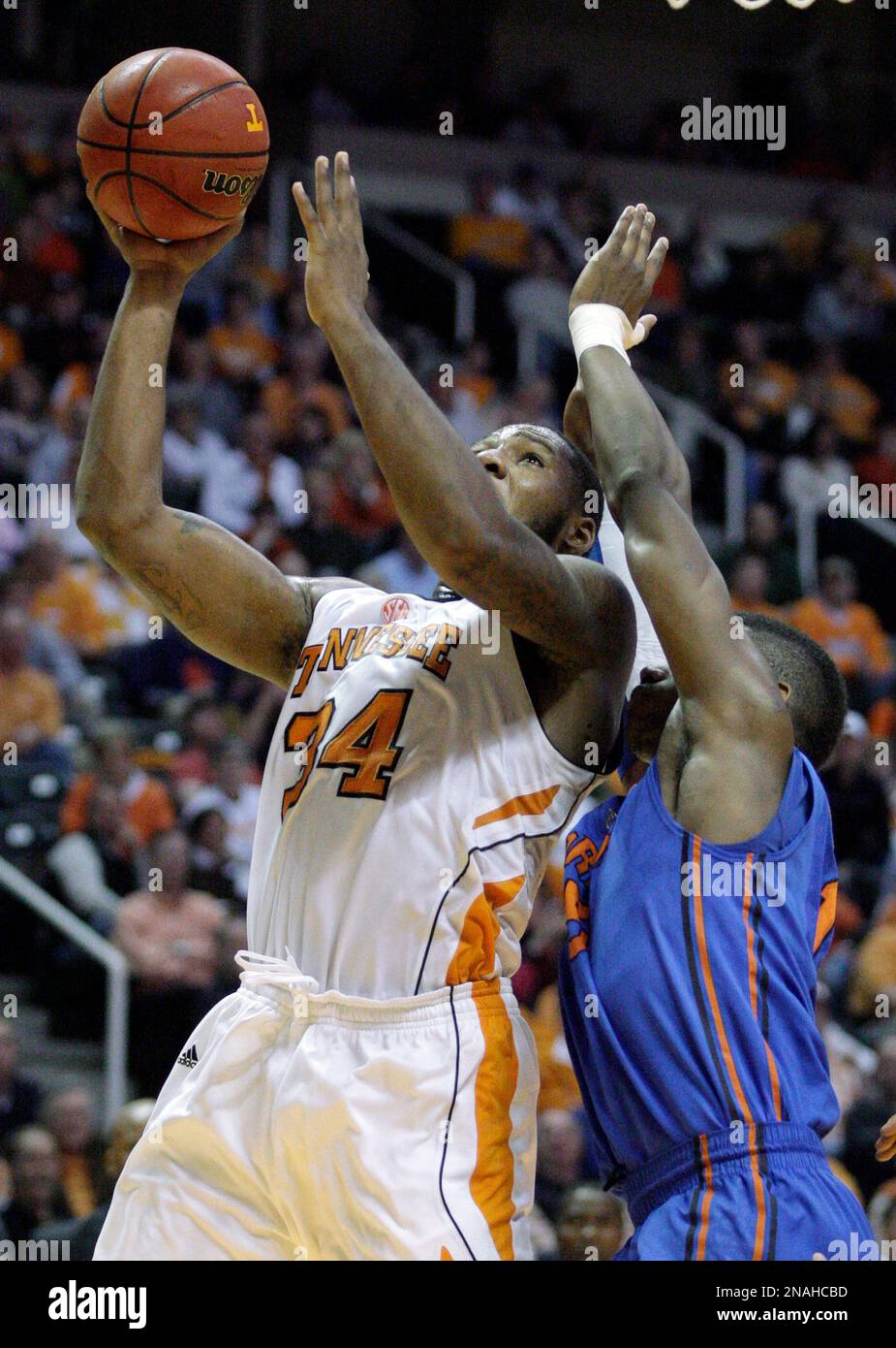 Tennessee's Jeronne Maymon (34) shoots past Florida's Will Yeguete in ...