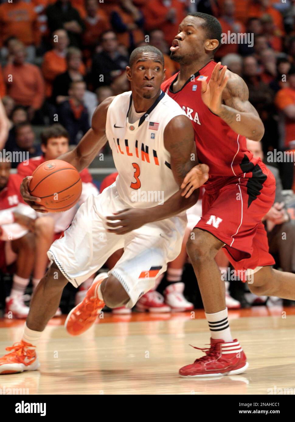 Illinois guard Brandon Paul (3) drives the baseline past Nebraska guard ...