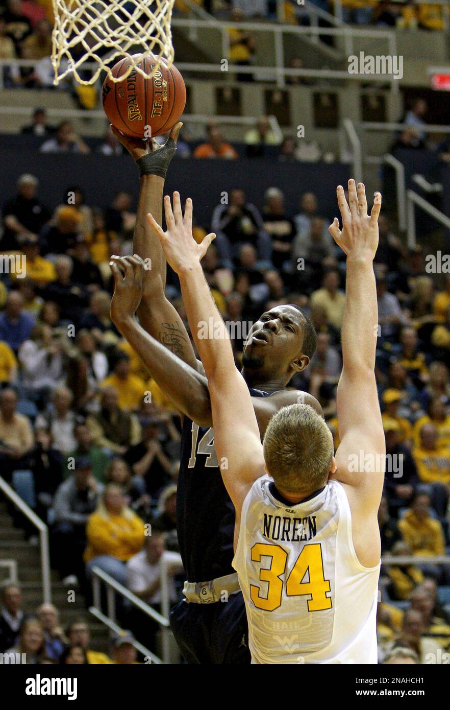 Georgetown's Henry Sims (14) shoots over West Virginia's Kevin Noreen ...