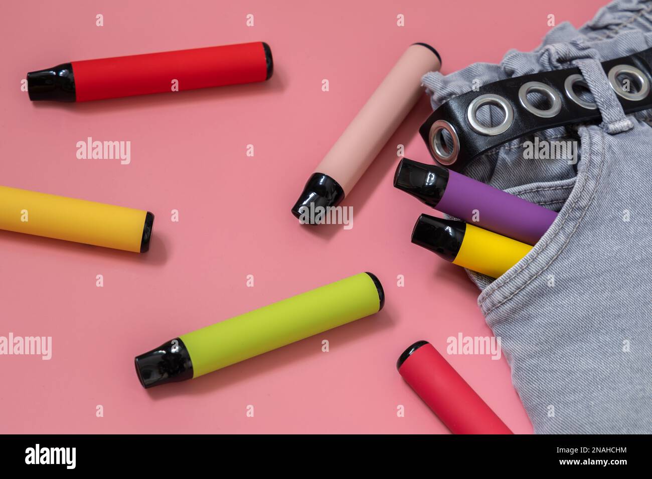 Layout of colorful disposable vapor stick on a light background ...