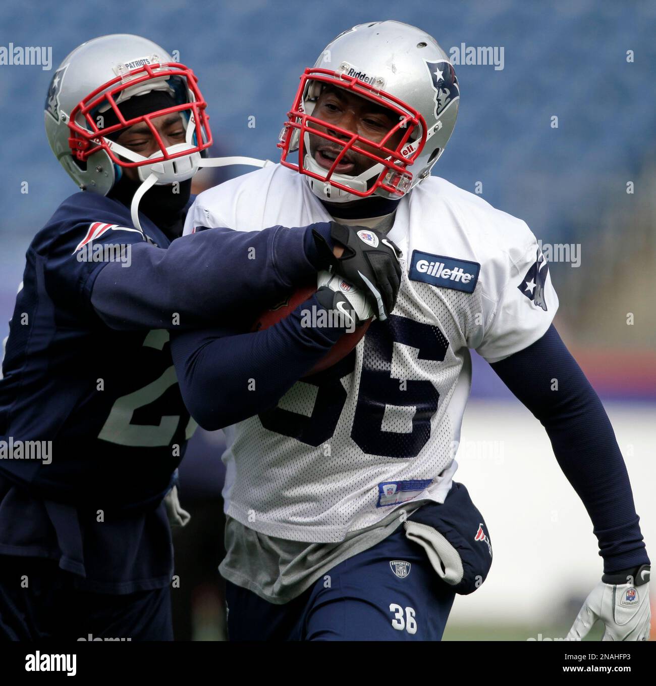 New England Patriots defensive back Nate Jones, left, tries to dislodge ...
