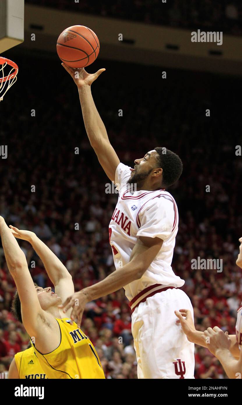 Indiana's Christian Watford (2) shoots voer Michigan's Evan Smotrycz ...