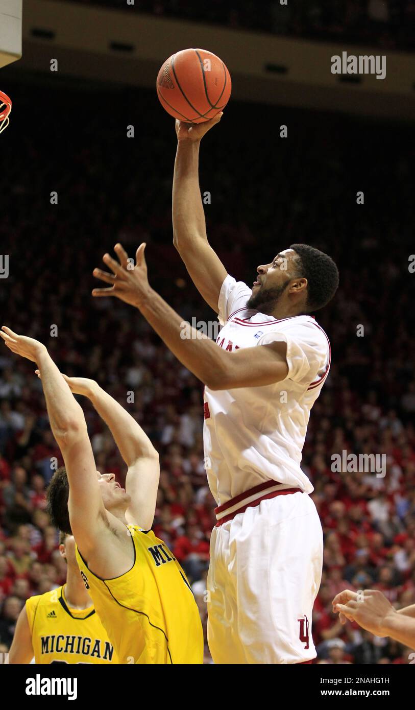 Indiana's Christian Watford (2) shoots voer Michigan's Evan Smotrycz ...
