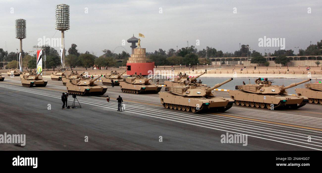 Iraqi Army soldiers are seen on M1A1 Abrams tanks at the Monument of ...