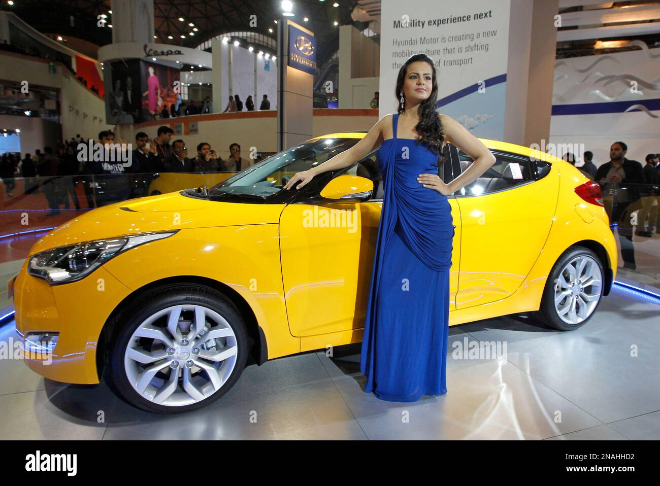 A model poses with the Hyundai Veloster at the India Auto Expo in New ...
