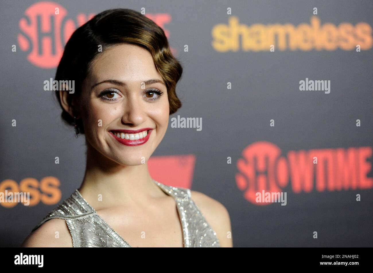 Emmy Rossum, a cast member in "Shameless," poses at the premiere of the ...