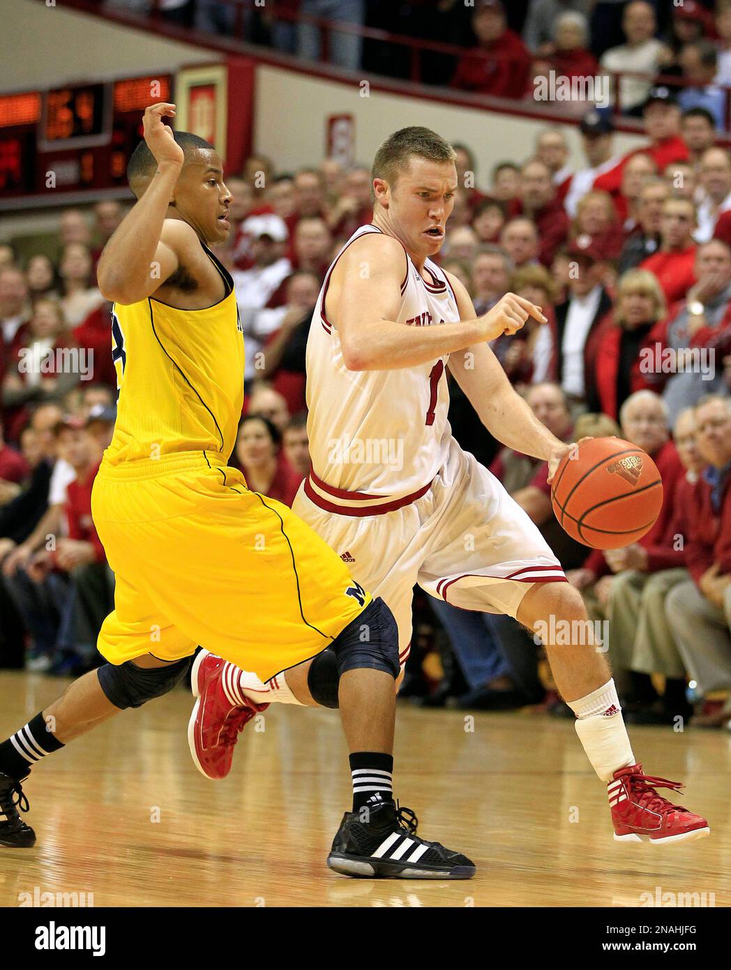 Indiana's Jordan Hulls drives to the basket against Michigan's Trey ...
