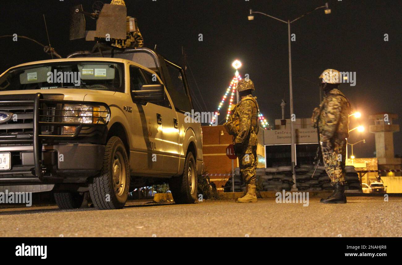 Mexican navy marines stand outside the Altamira prison in the town of ...
