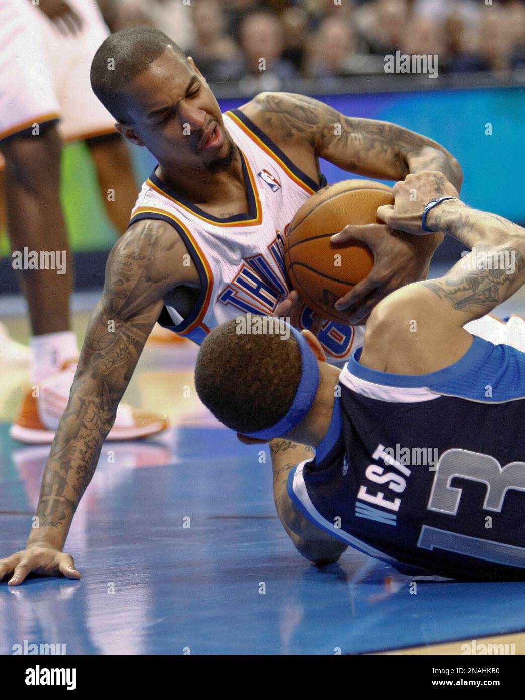Oklahoma City Thunder's Eric Maynor, back, and Dallas Mavericks Delonte ...