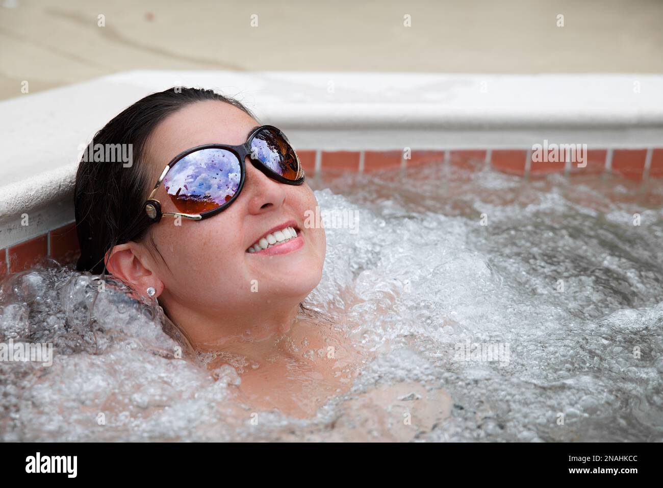 Lounging in pool hi-res stock photography and images - Alamy
