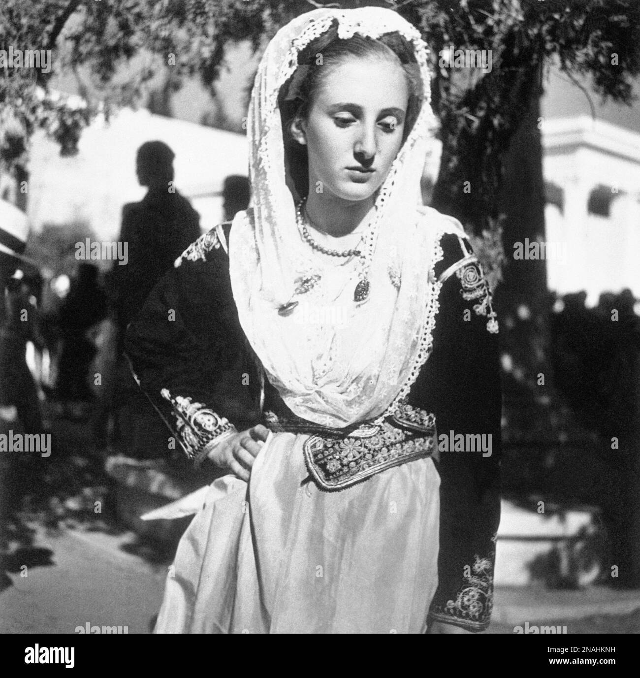 A Greek peasant girl in traditional costume of the island of Corfu in ...