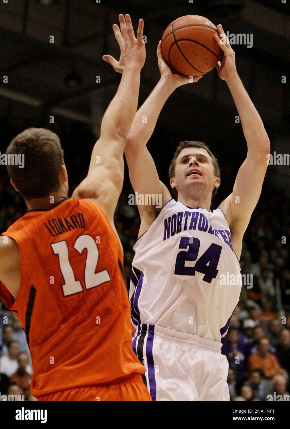 Northwestern's John Shurna (24) shoots over Illinois' Meyers Leonard ...