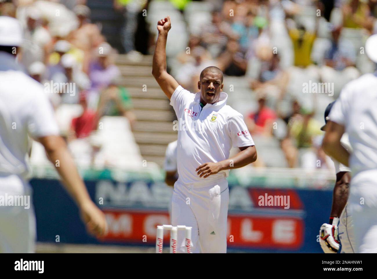 South African bowler Vernon Philander, center, reacts after taking the ...