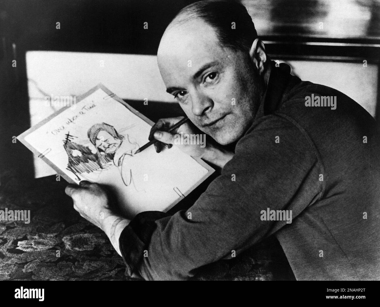 British cartoonist Captain Charles Bruce Bairnsfather shown drawing ...