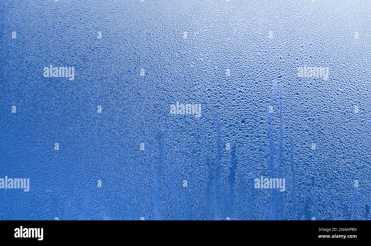 Background condensation of water on the window glass due to high ...