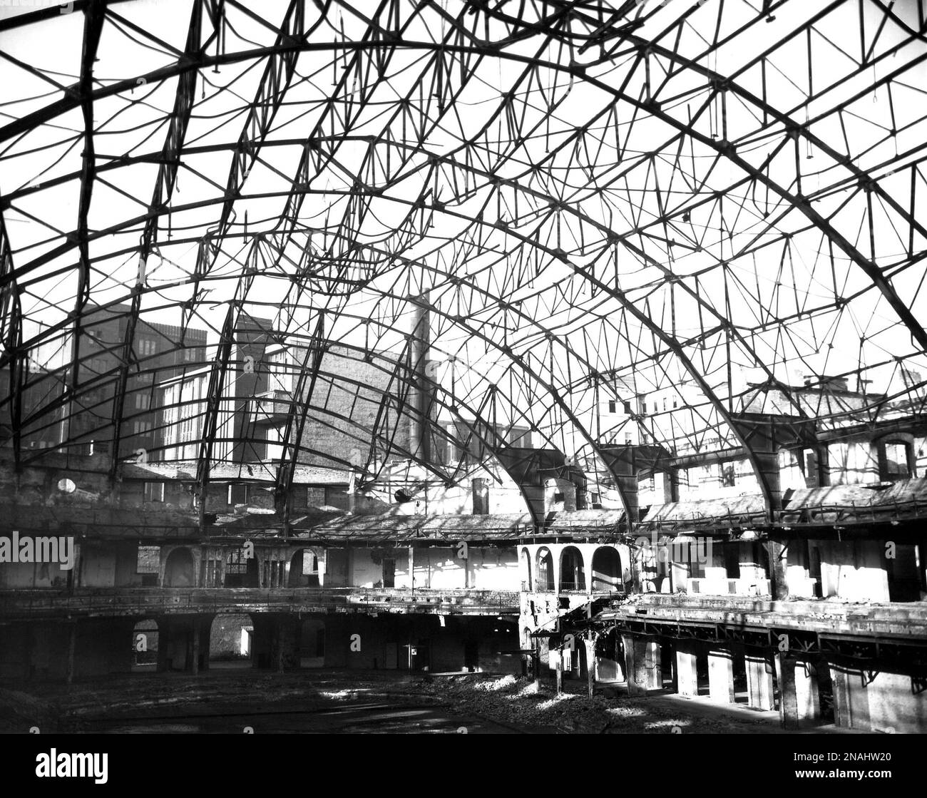 A framework of twisted steel is all that remains of the huge roof which ...