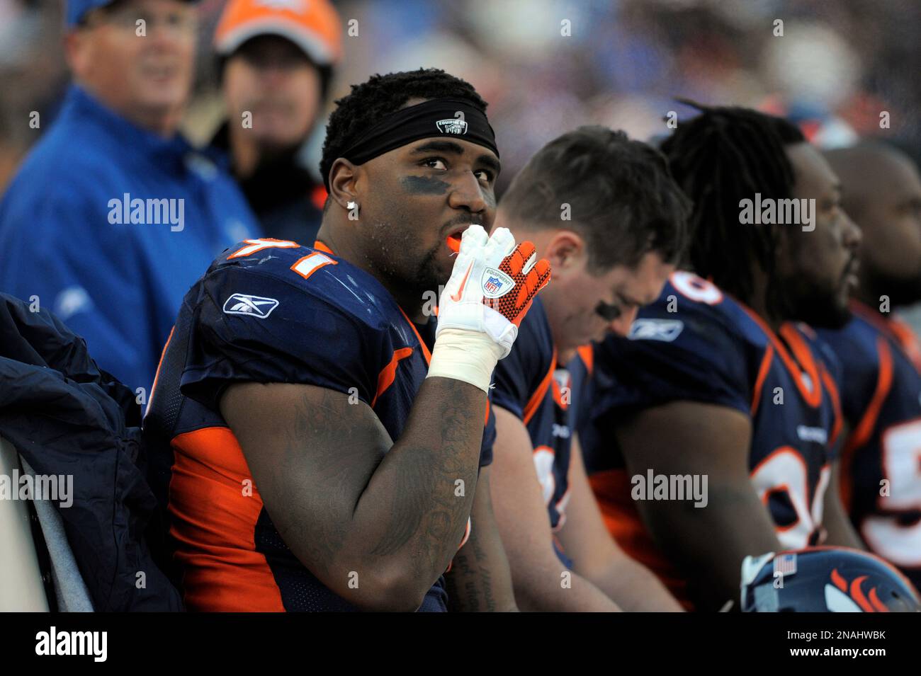 Denver Broncos defensive end Robert Ayers looks on from the sidelines ...