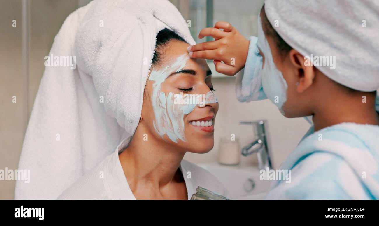 Family, facial and mask with mother in bathroom with young child using ...