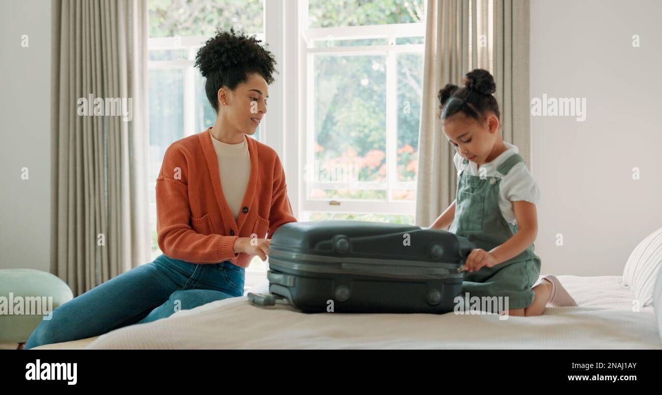 Travel, luggage and mom packing with child in bedroom getting ready for ...