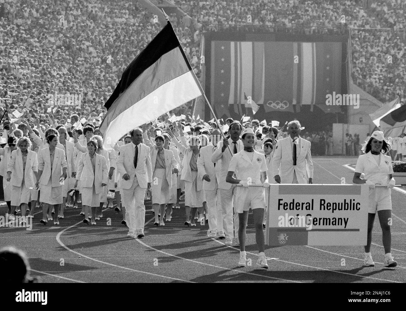 The West German Olympic team parade in the Coliseum stadium of Los ...
