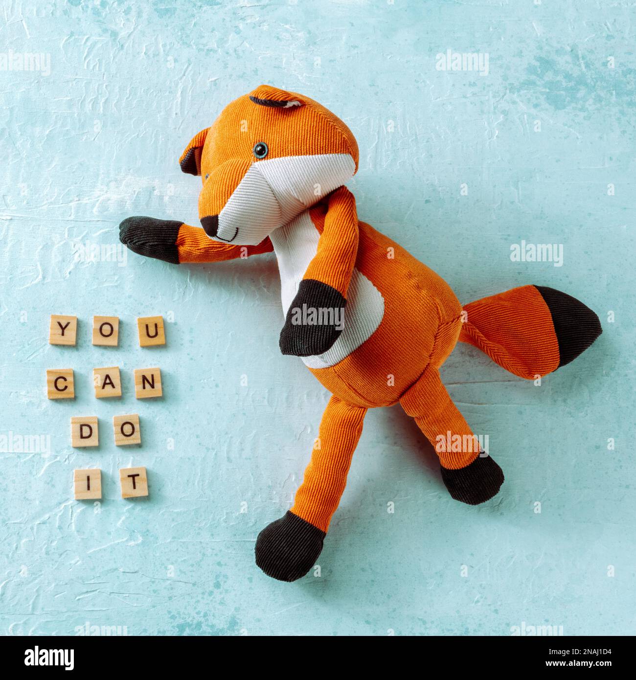 You can do it, square motivational banner with a toy fox on a blue ...