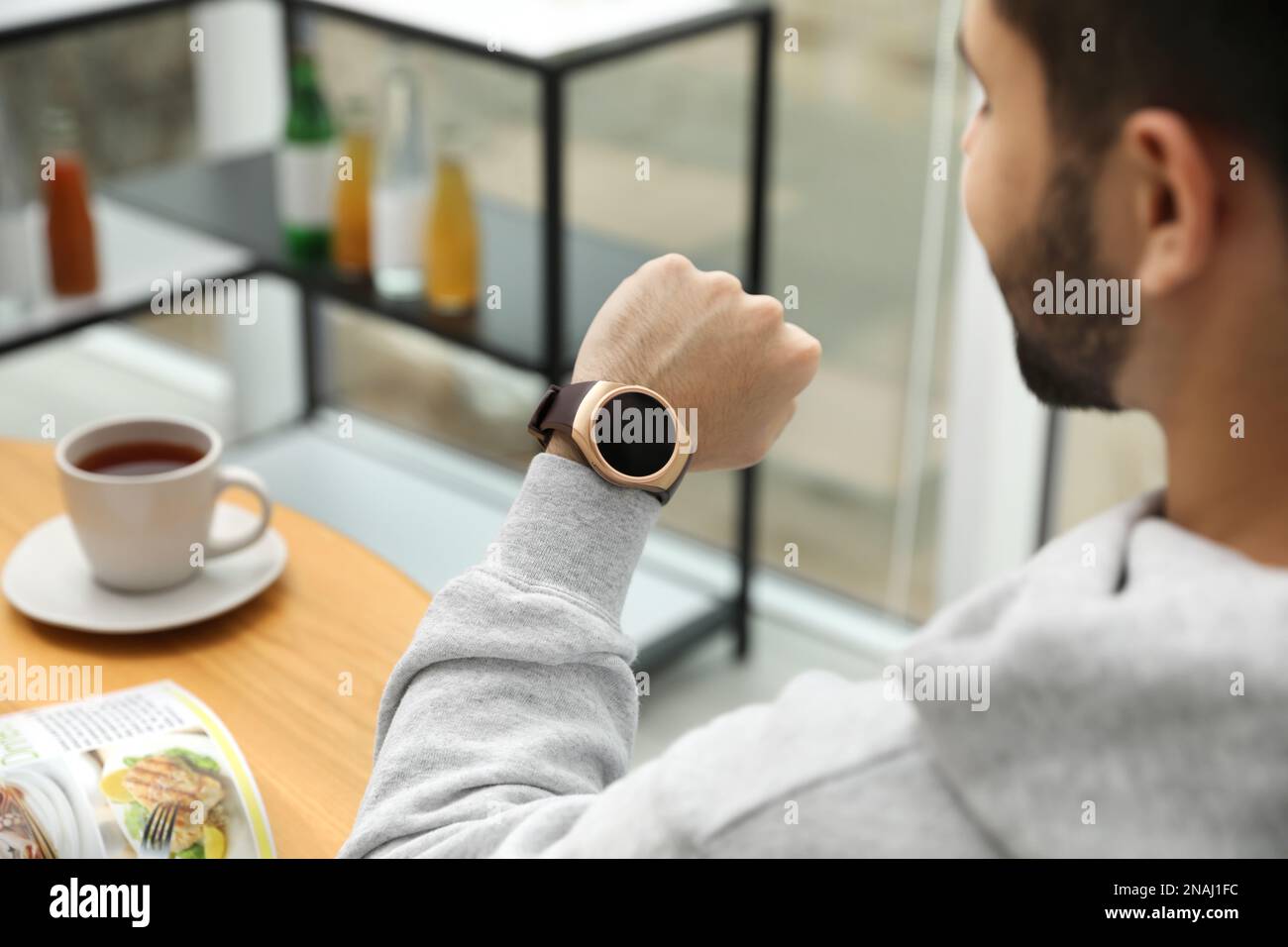 Black man using smartwatch in hi-res stock photography and images - Alamy