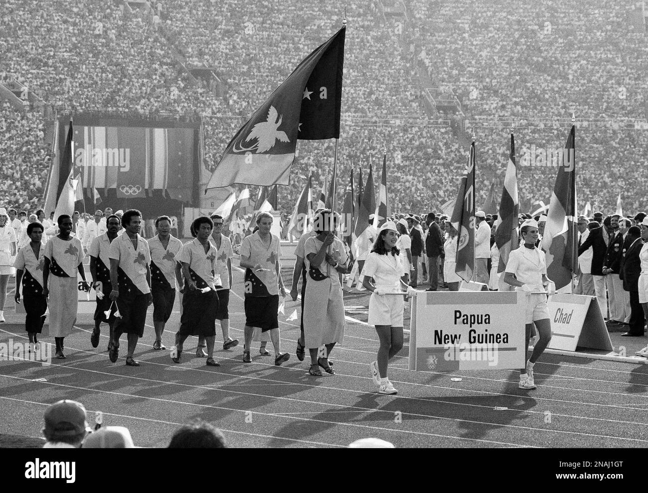 Members of the Papua New Guinea Olympic team march in the Parade of the ...