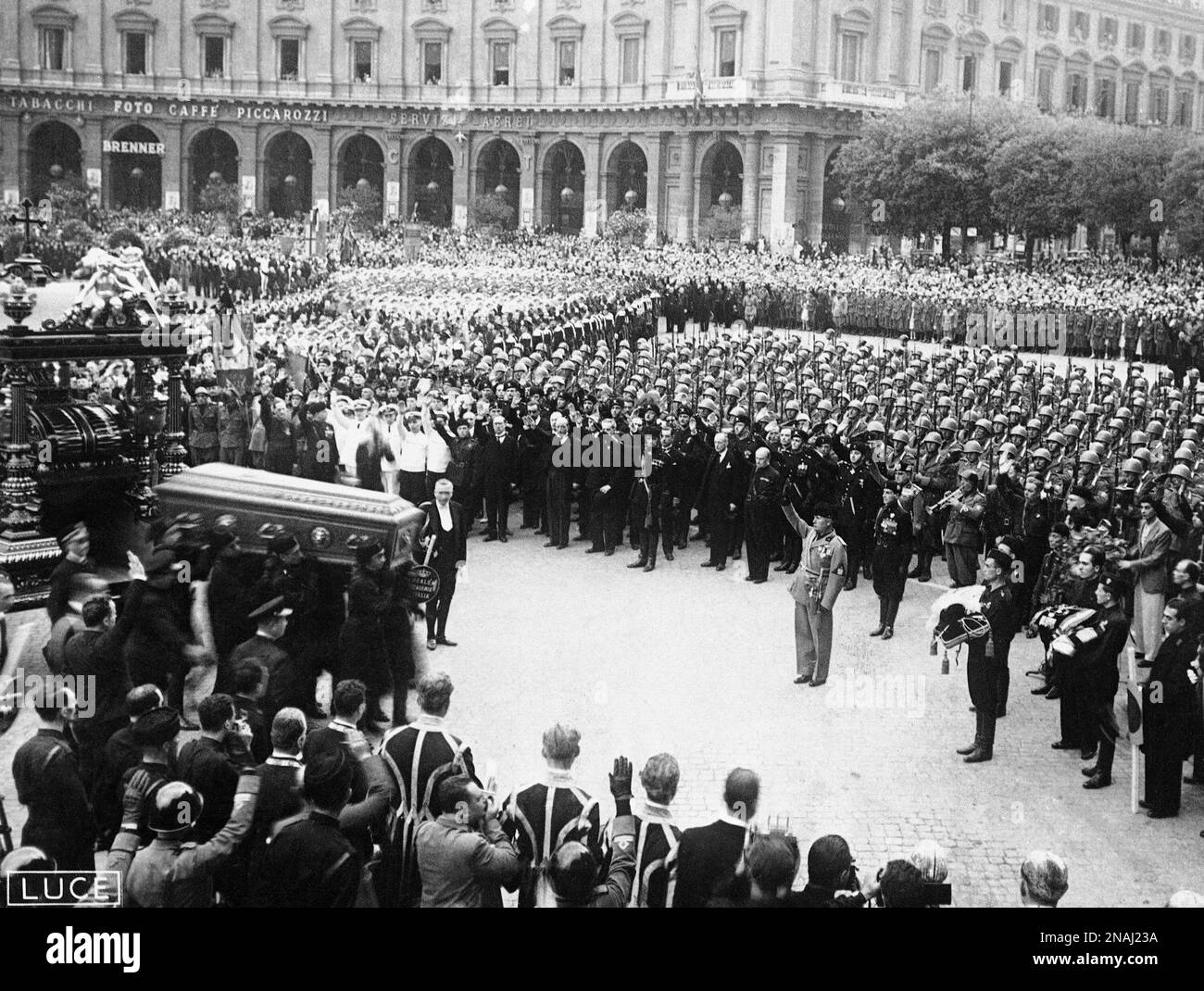 Italian fascist leader Benito Mussolini, officials and soldiers, attend ...