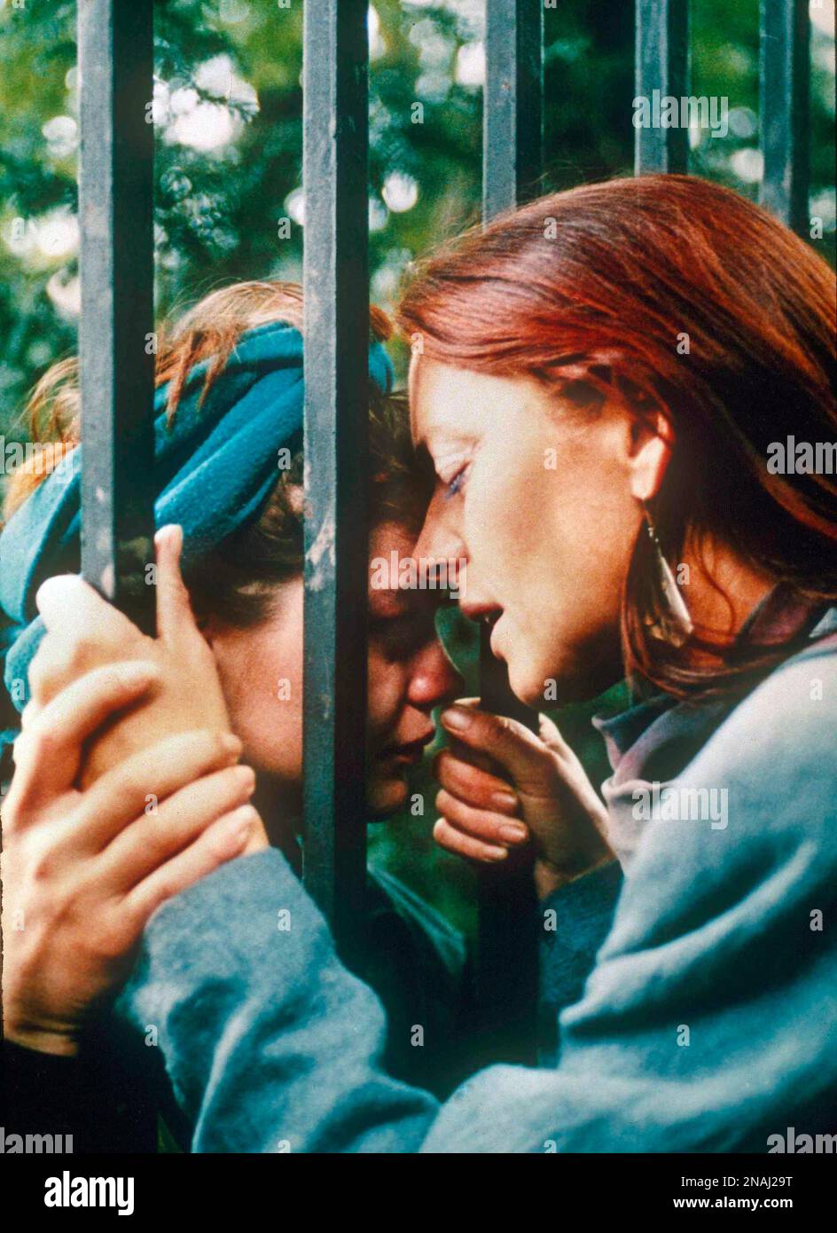 An East German mother cries as she says goodbye to her daughter as the ...