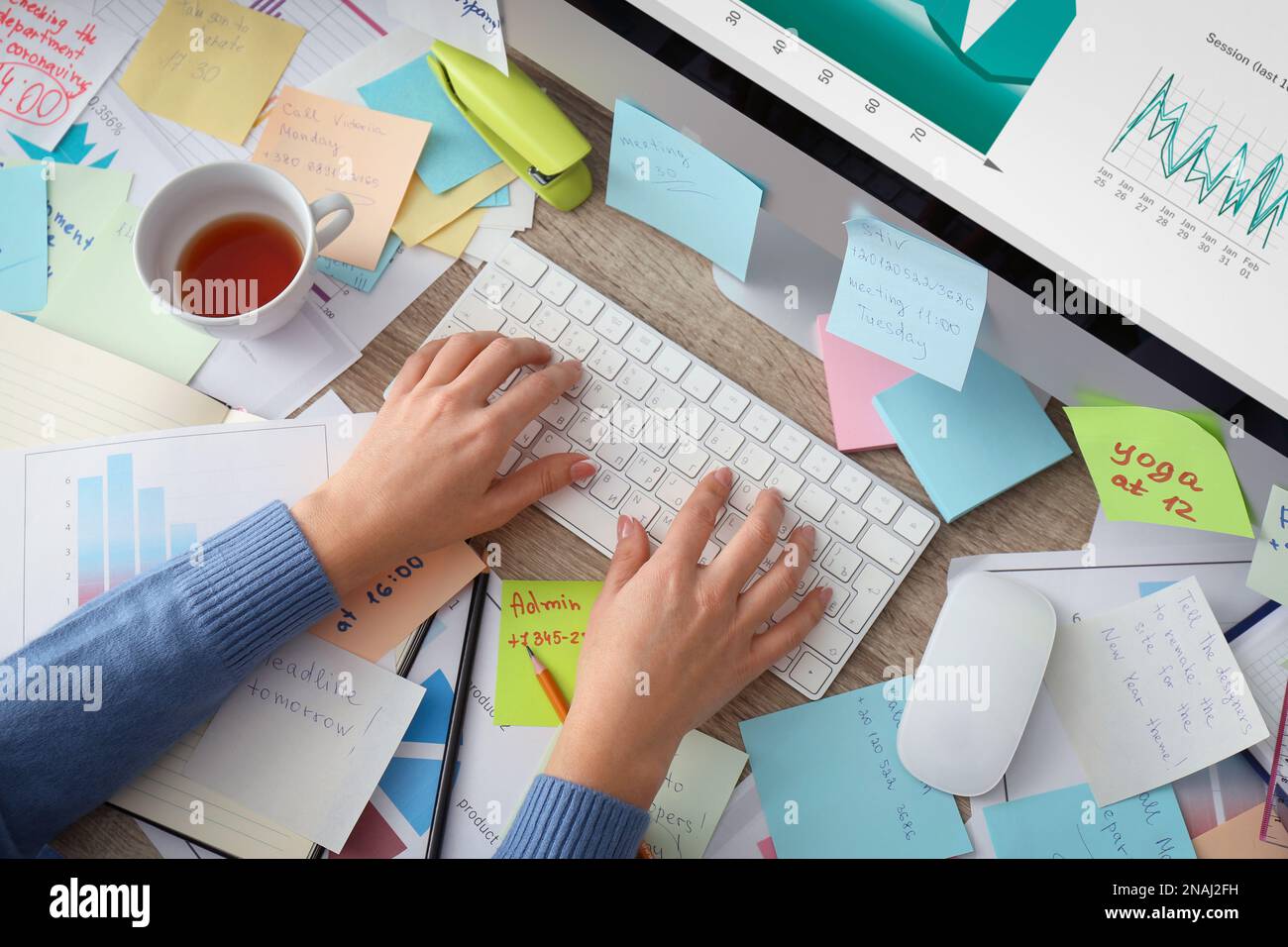 Overwhelmed woman working at messy office desk, above view Stock Photo ...