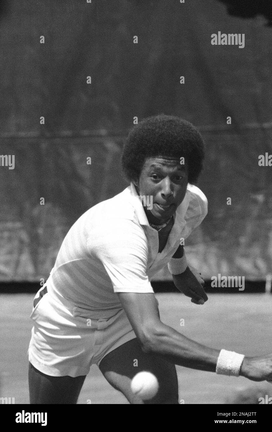 Arthur Ashe reaches for a backhand return on a shot by India's Vijay ...