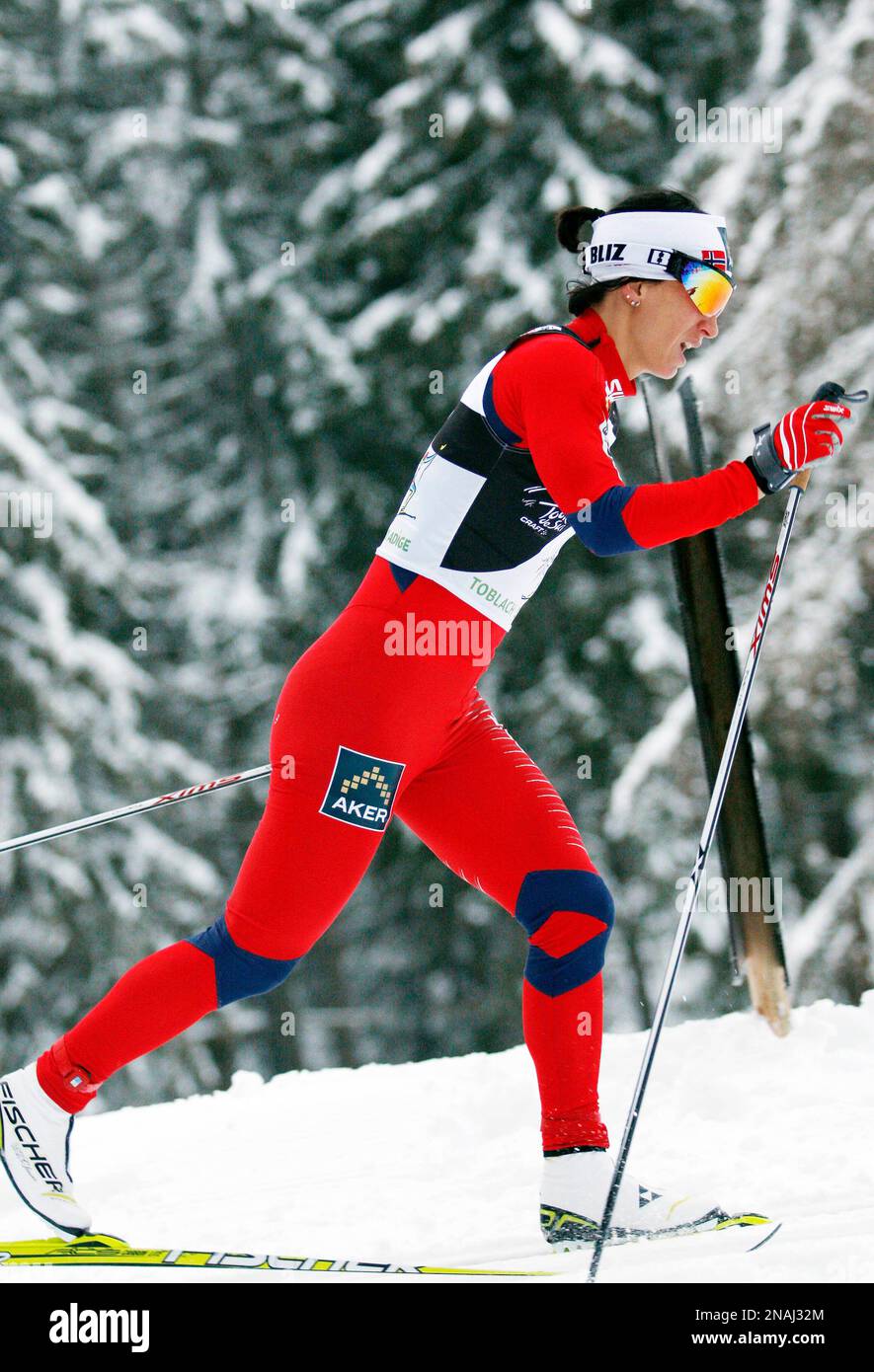 First placed Marit Bjoergen, of Norway, makes her way during a cross ...