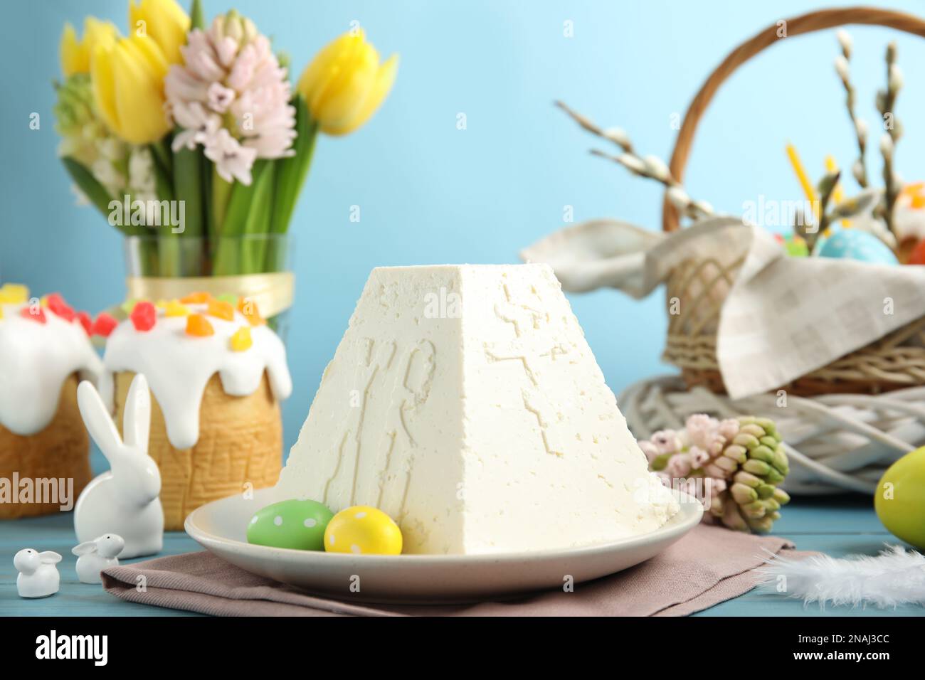 Traditional cottage cheese Easter paskha on light blue wooden table Stock Photo - Alamy