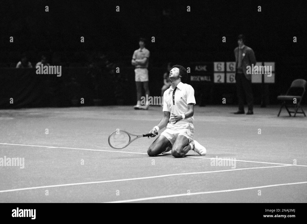 Arthur Ashe of the United States drops to his knees after missing a tie ...