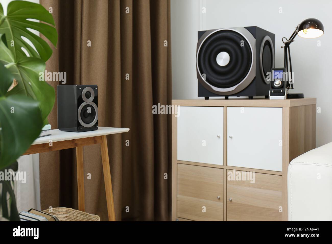 Modern powerful audio speaker system in bright room Stock Photo - Alamy