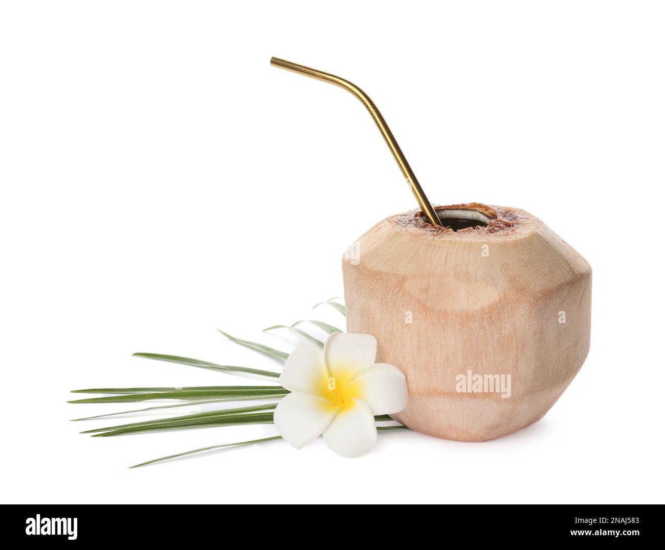 Young peeled coconut with straw, palm leaf and beautiful flower ...