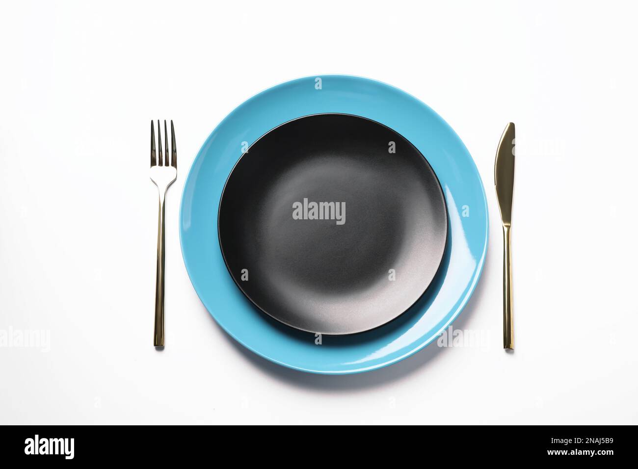 Stylish table setting on white background, top view Stock Photo - Alamy