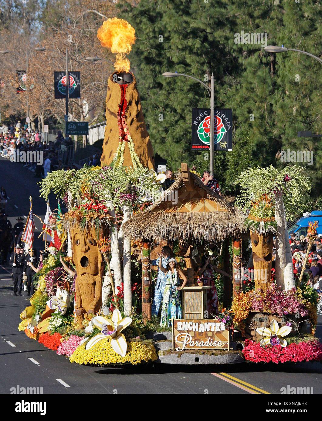 Fire erupts from a volcano on the Downey Rose Float Association's "Enchanted Paradise" float in ...