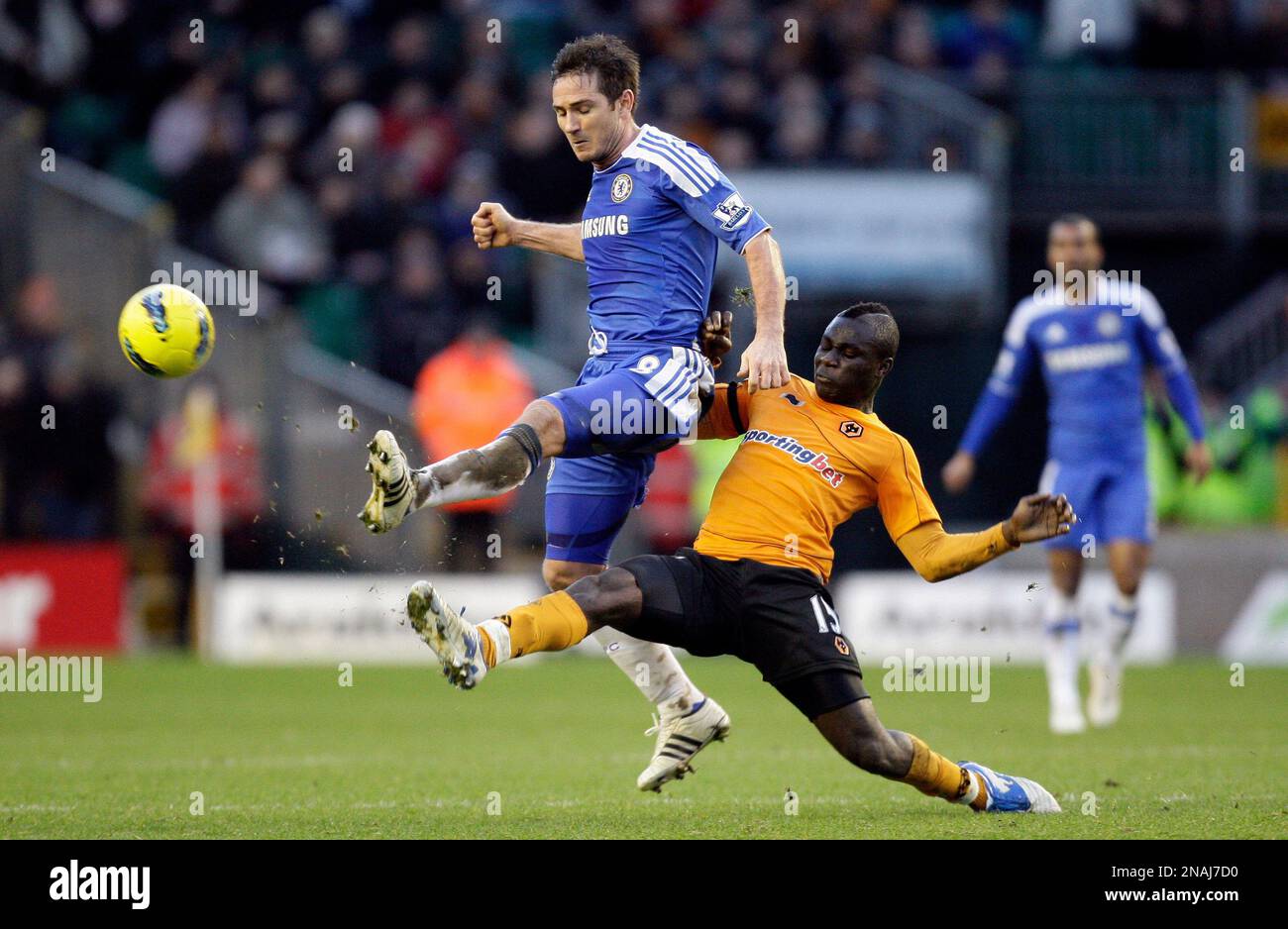 Wolverhampton Wanderers' Emmanuel Frimpong, right, tackles Chelsea's ...