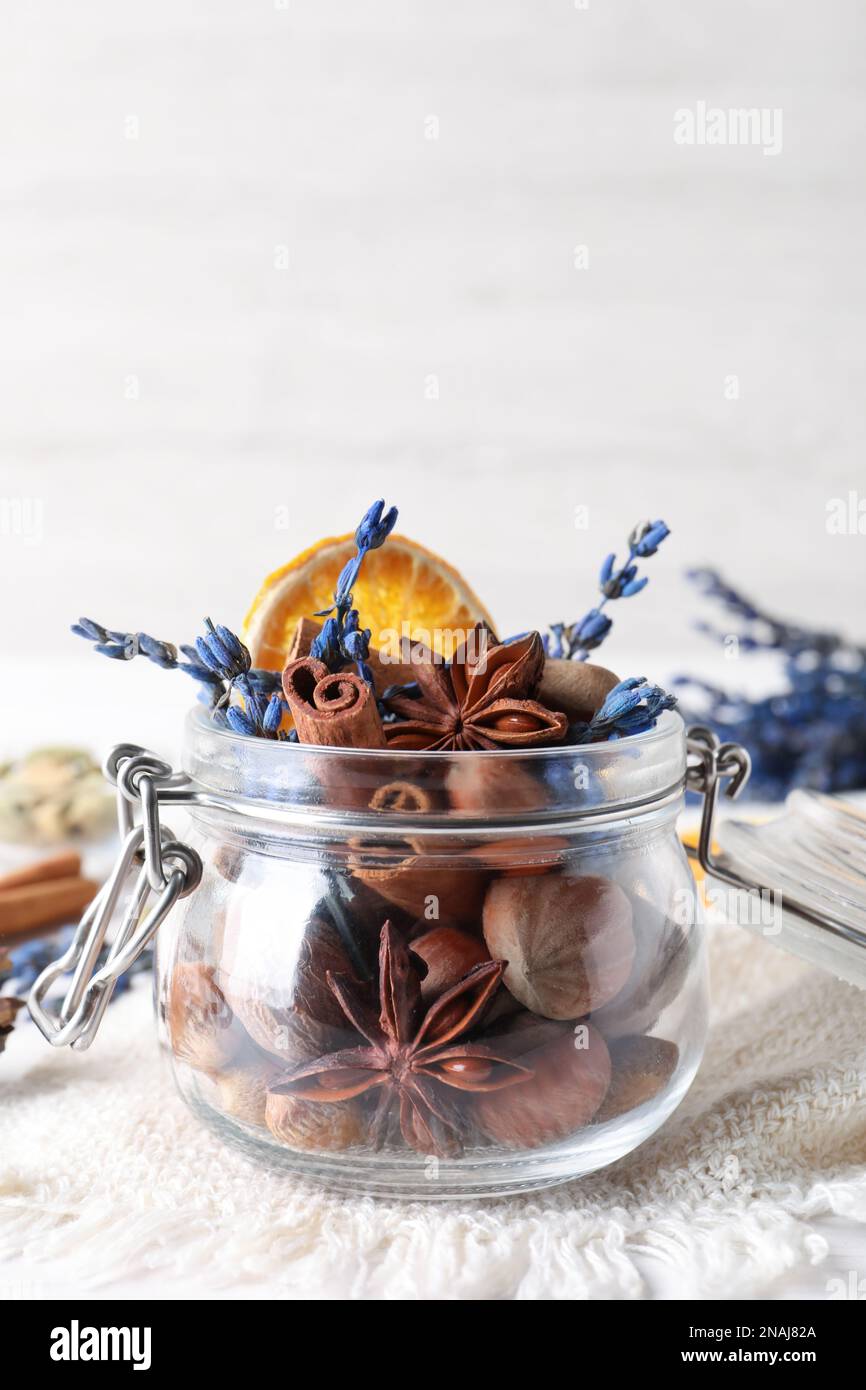Aromatic potpourri in glass jar on white background Stock Photo - Alamy