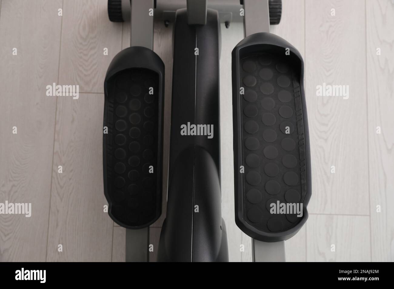 Modern elliptical machine cross trainer on floor, top view Stock Photo ...