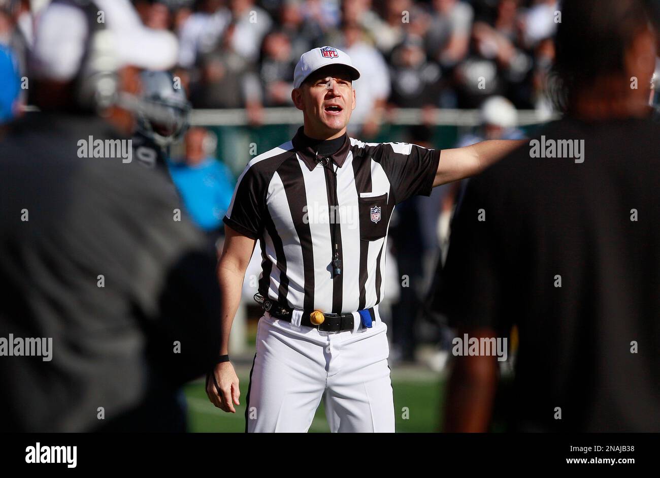 Referee Clete Blakeman calls a penalty against the Oakland Raiders ...